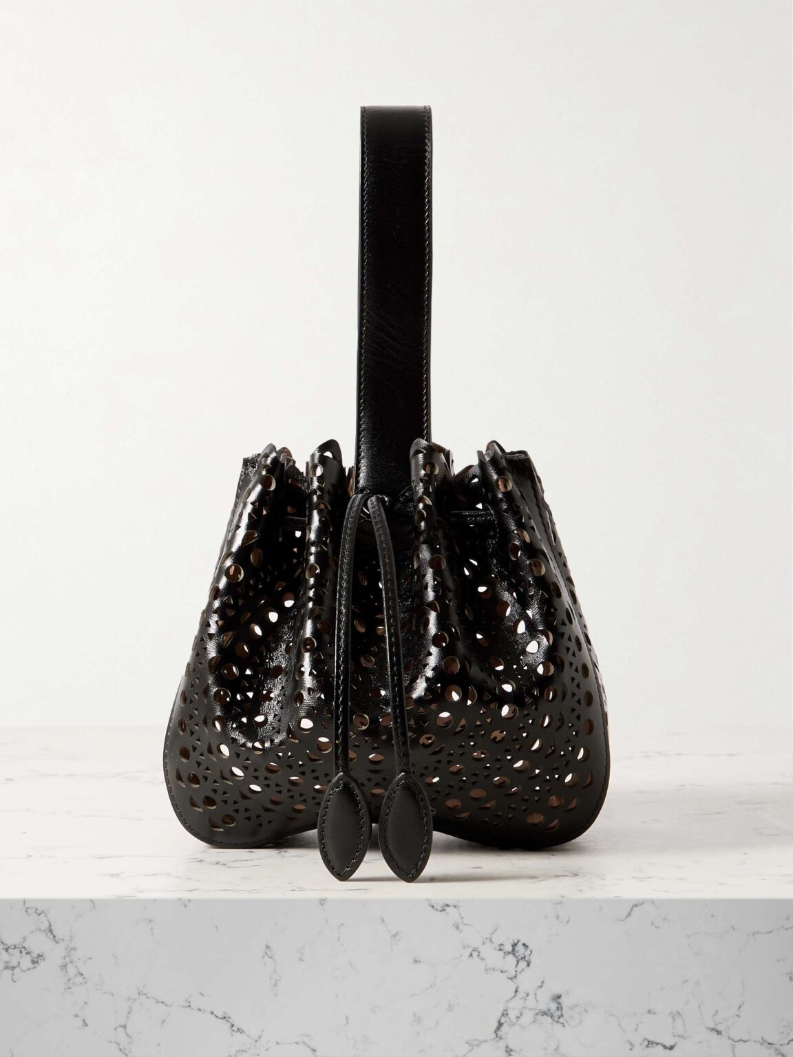 ALAÏA Rose Marie Small Laser-cut Leather Bucket Bag - We Select Dresses