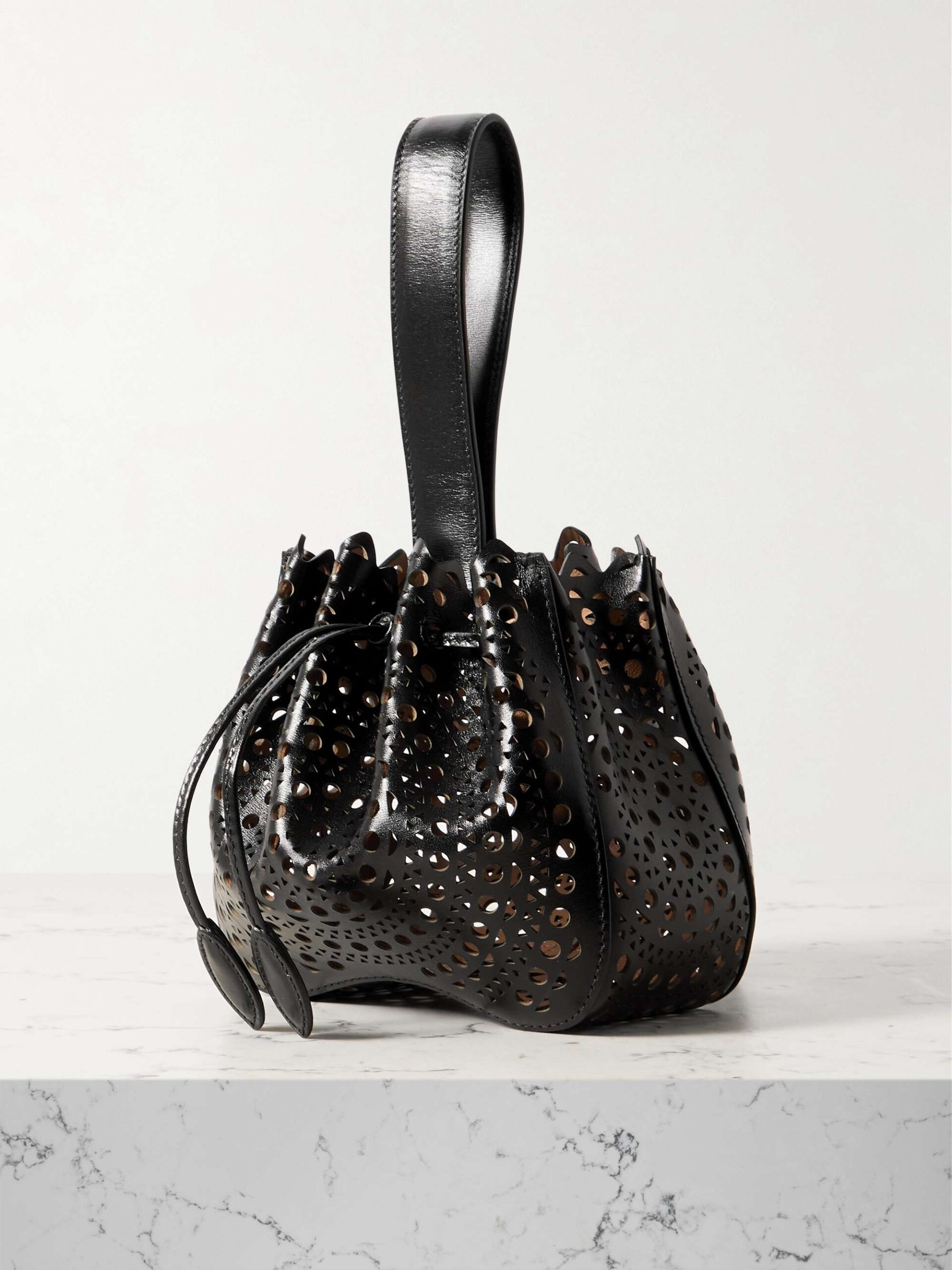 ALAÏA Rose Marie Small Laser-cut Leather Bucket Bag - We Select Dresses